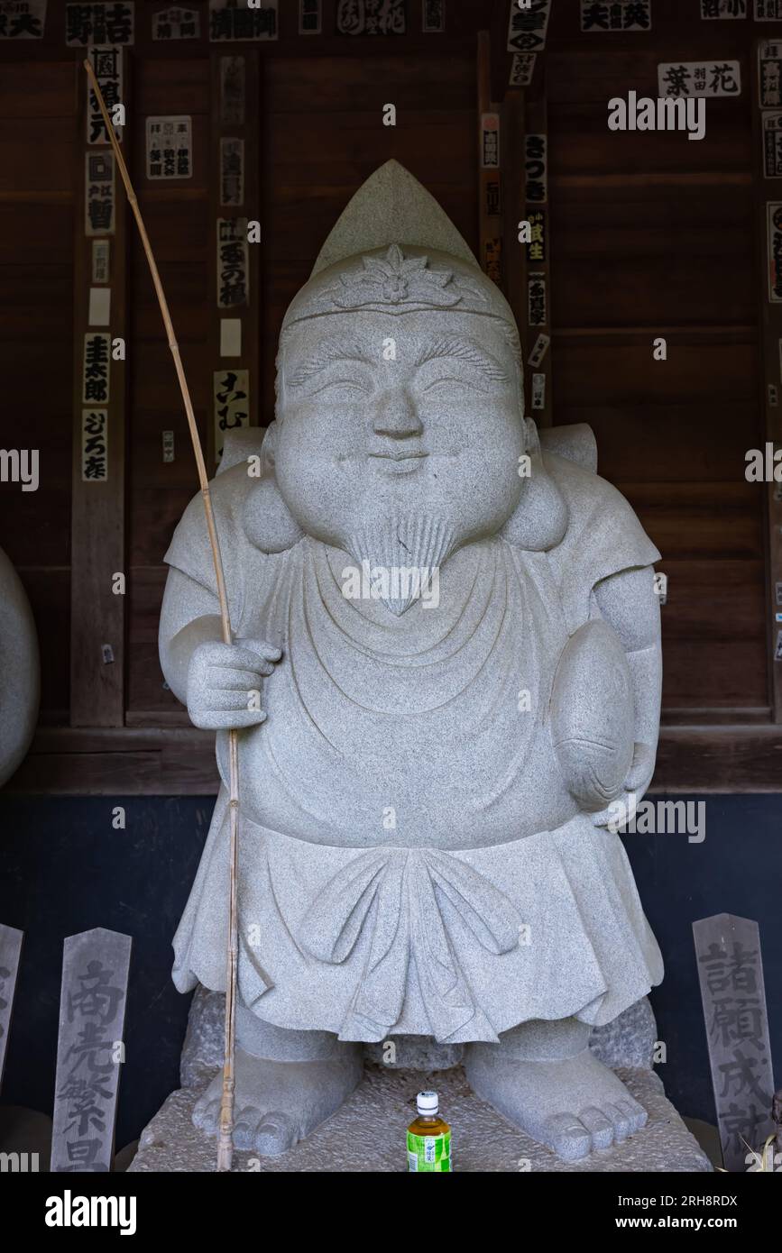 A Japanese guardian statue at the traditional street in Tokyo Stock ...