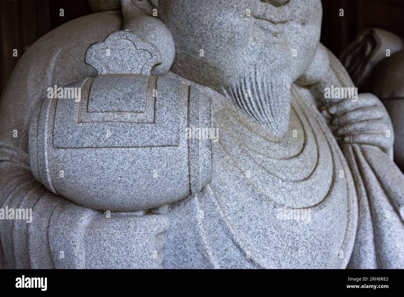 A Japanese guardian statue at the traditional street in Tokyo closeup ...