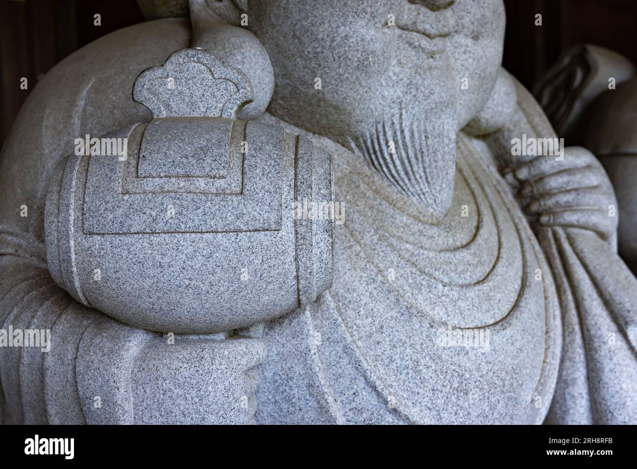 A Japanese guardian statue at the traditional street in Tokyo closeup ...