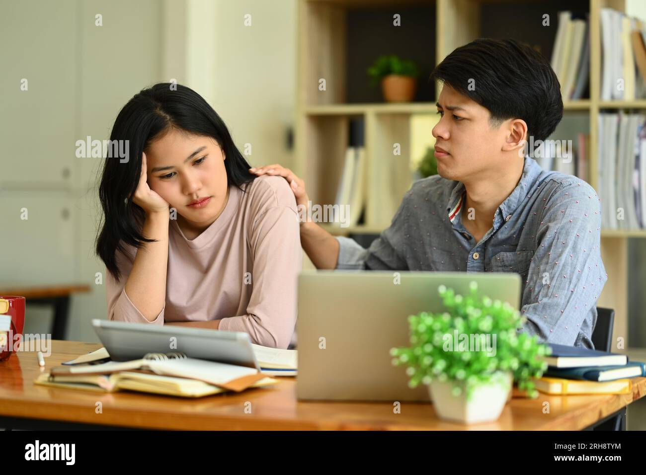 Caring male student consoling his female friend. Friendship, support ...