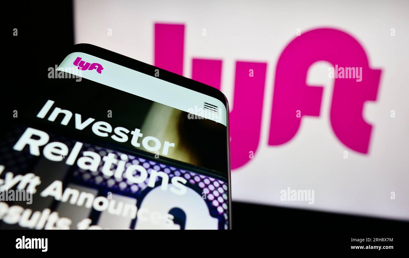 Smartphone with website of US mobility company Lyft Inc. on screen in ...