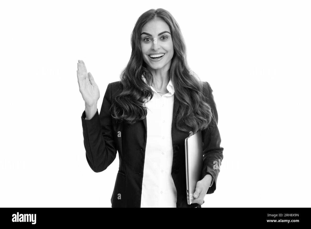 Portrait of a cheerful young casual girl standing isolated over gray ...