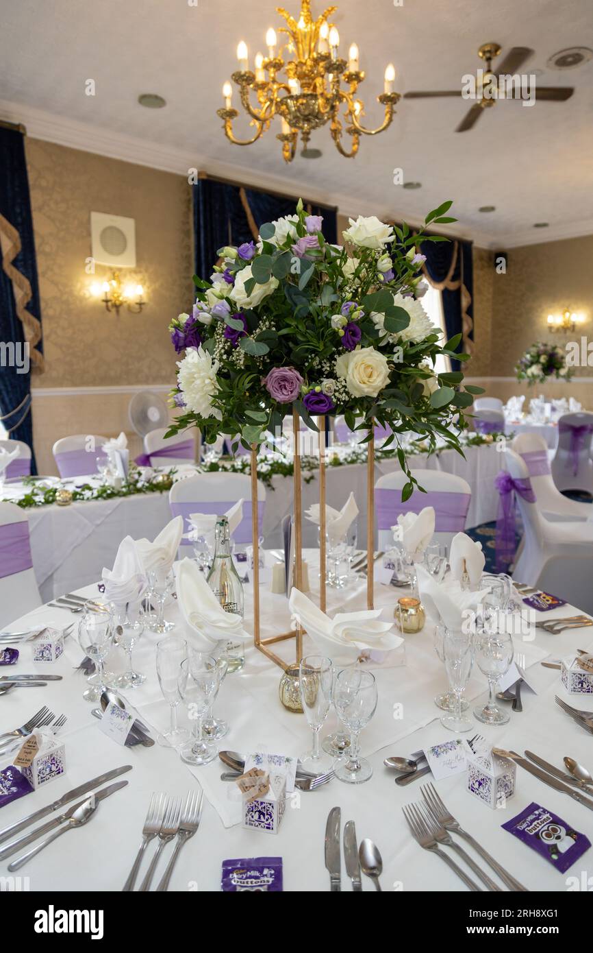 An empty wedding reception area set up with tables, ready for guests to ...