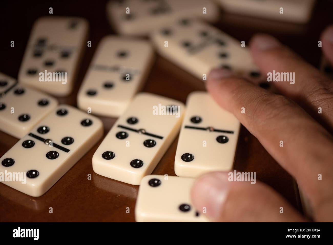 Close up Domino tiles on the table. Dominoes is one of the most famous ...