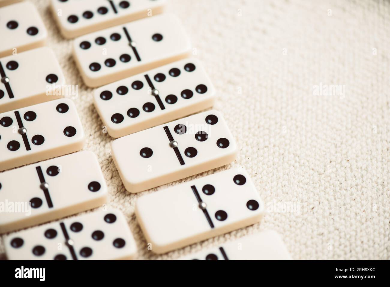 Domino tiles on the cloth. Dominoes is one of the most famous classic ...