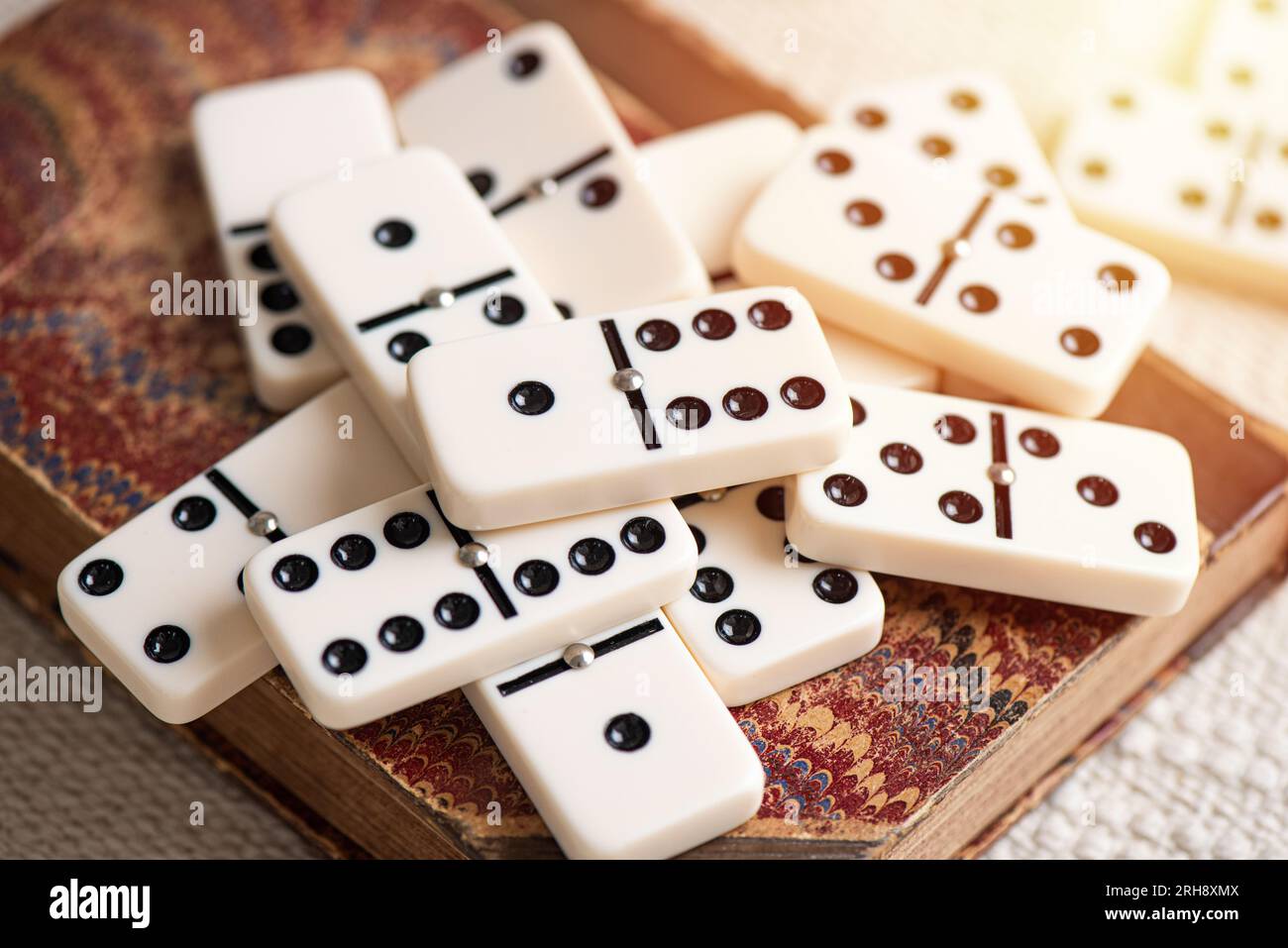 Heap of Domino tiles on the table. Dominoes is one of the most famous ...