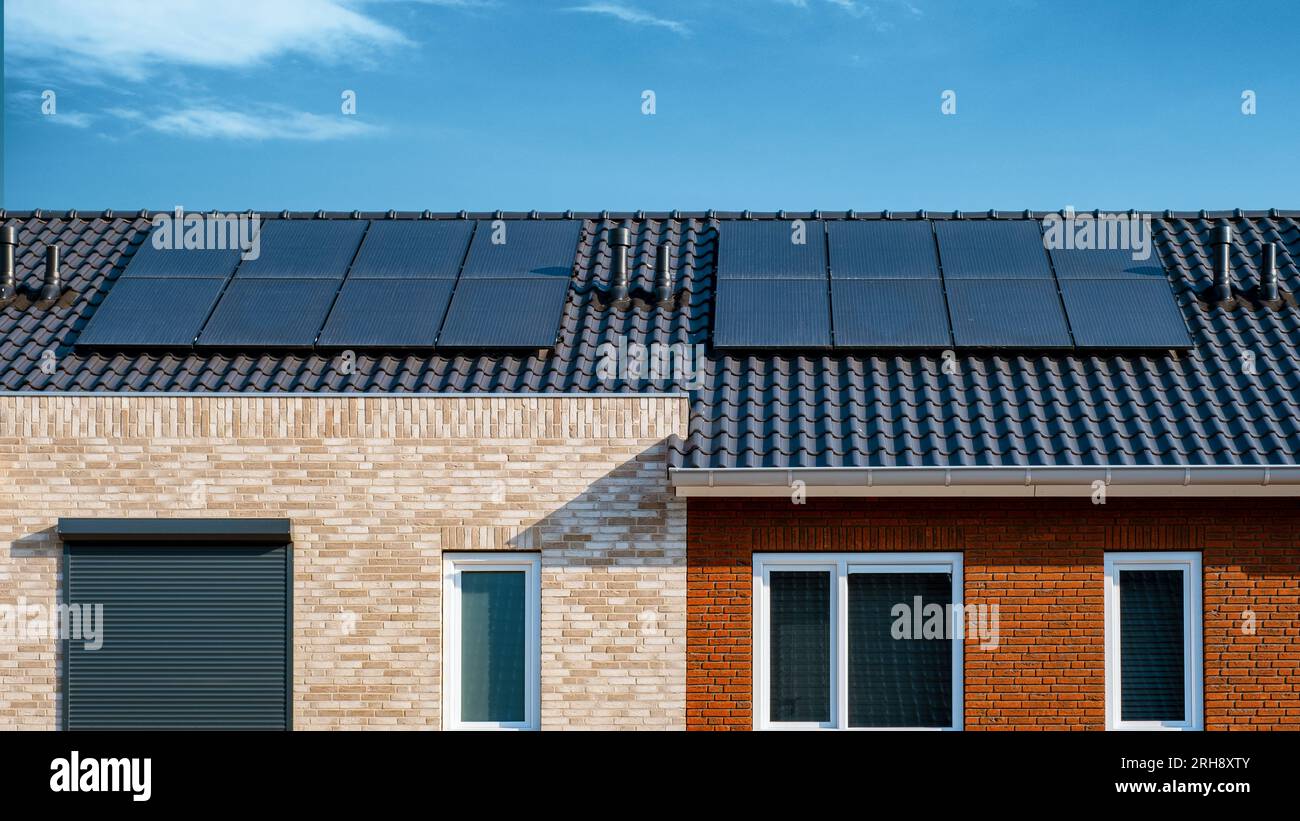 Newly build houses with solar panels attached on the roof ...