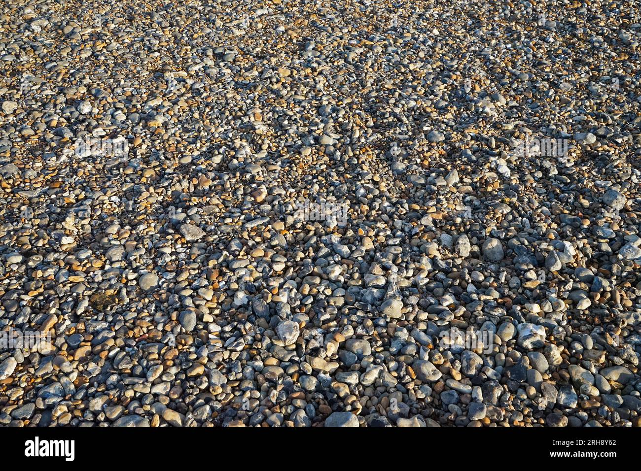Natural sea stone pebble and texture sand Stock Photo - Alamy