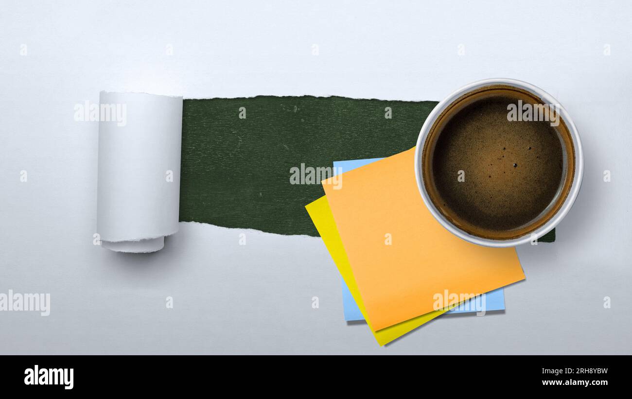 Cup of coffee with empty paper on torn paper background. International ...