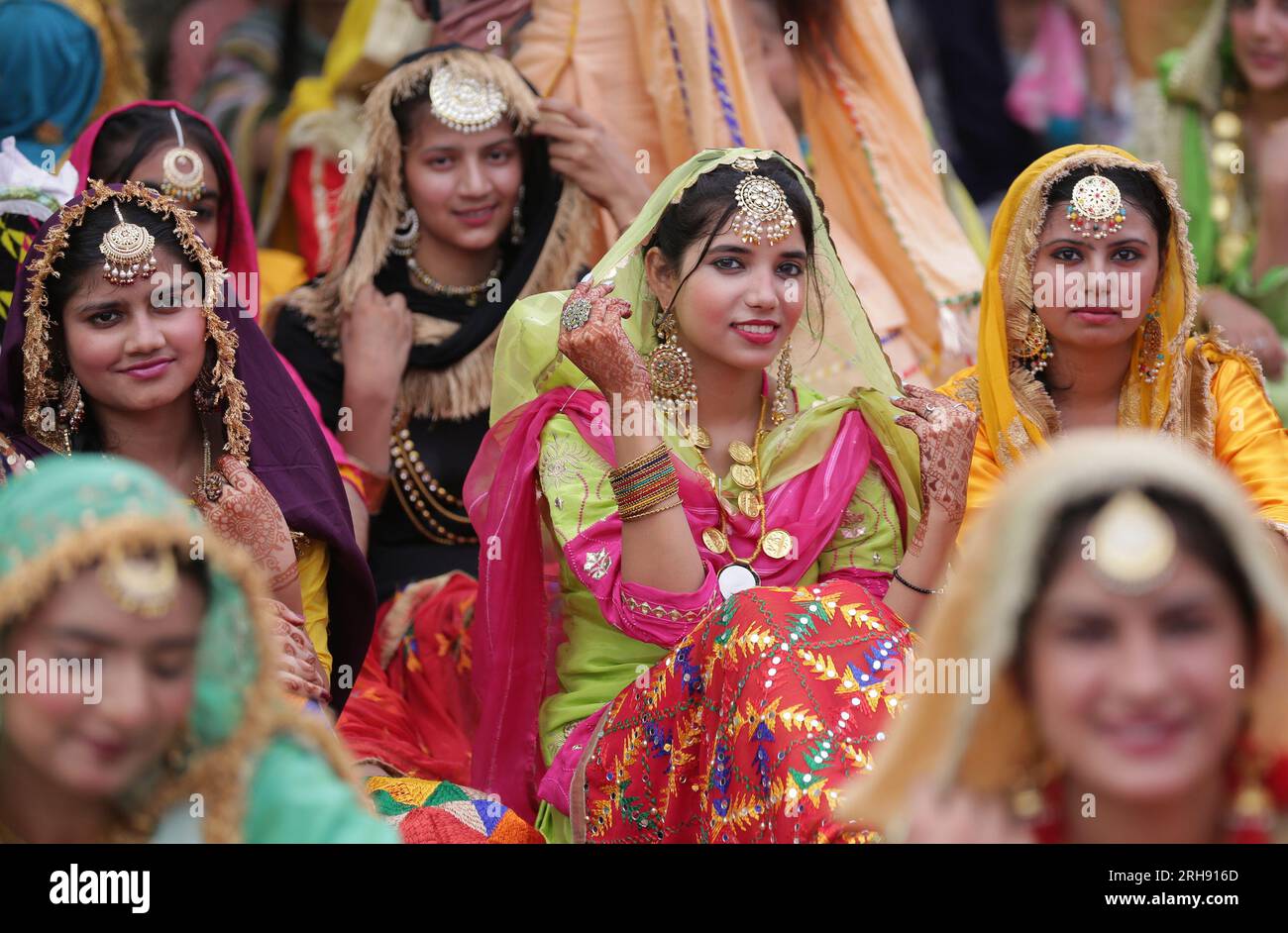 Amritsar. 14th Aug, 2023. Women in traditional Punjabi attire celebrate ...