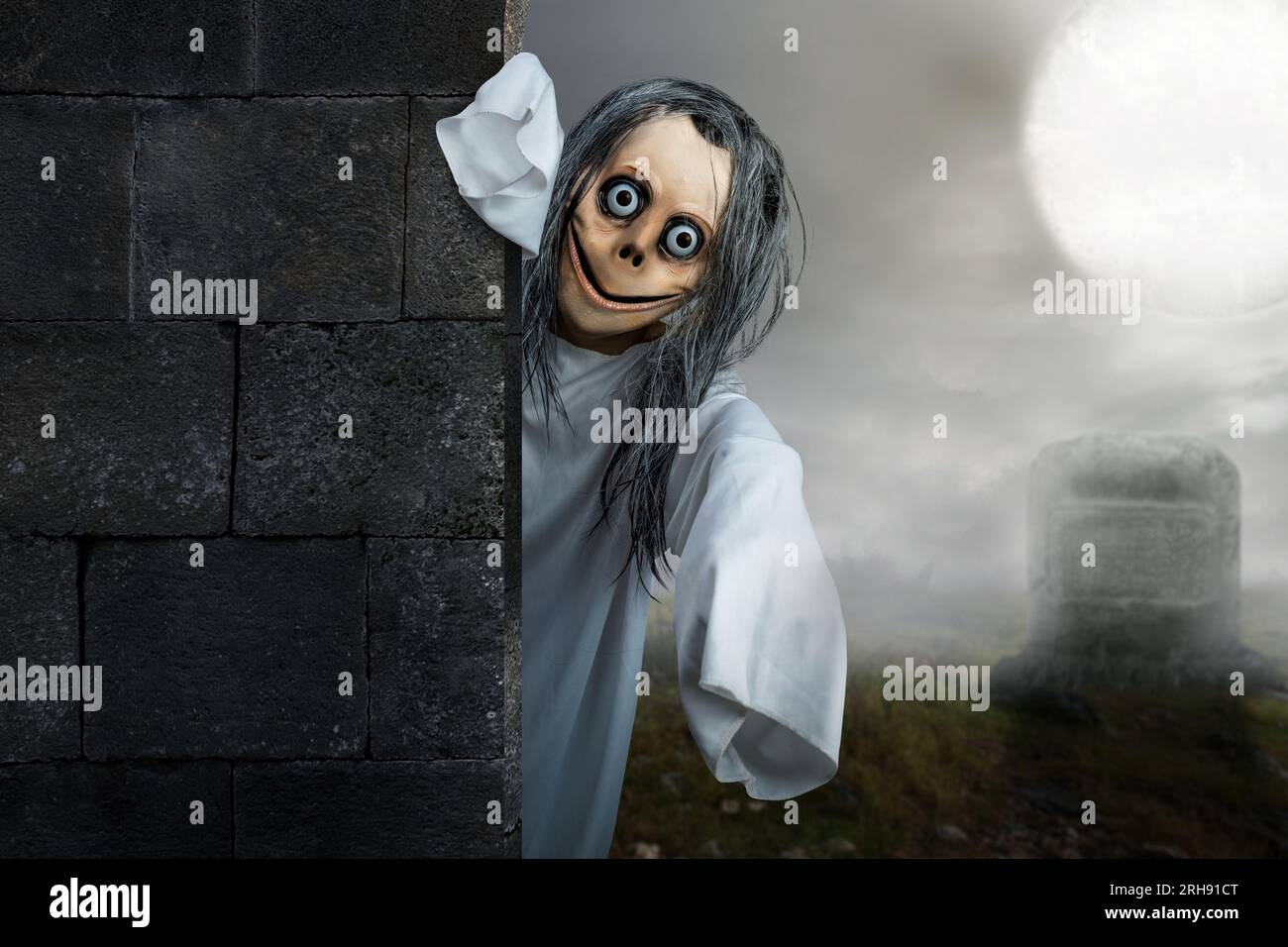 Scary Momo standing in the graveyard with a night scene background ...