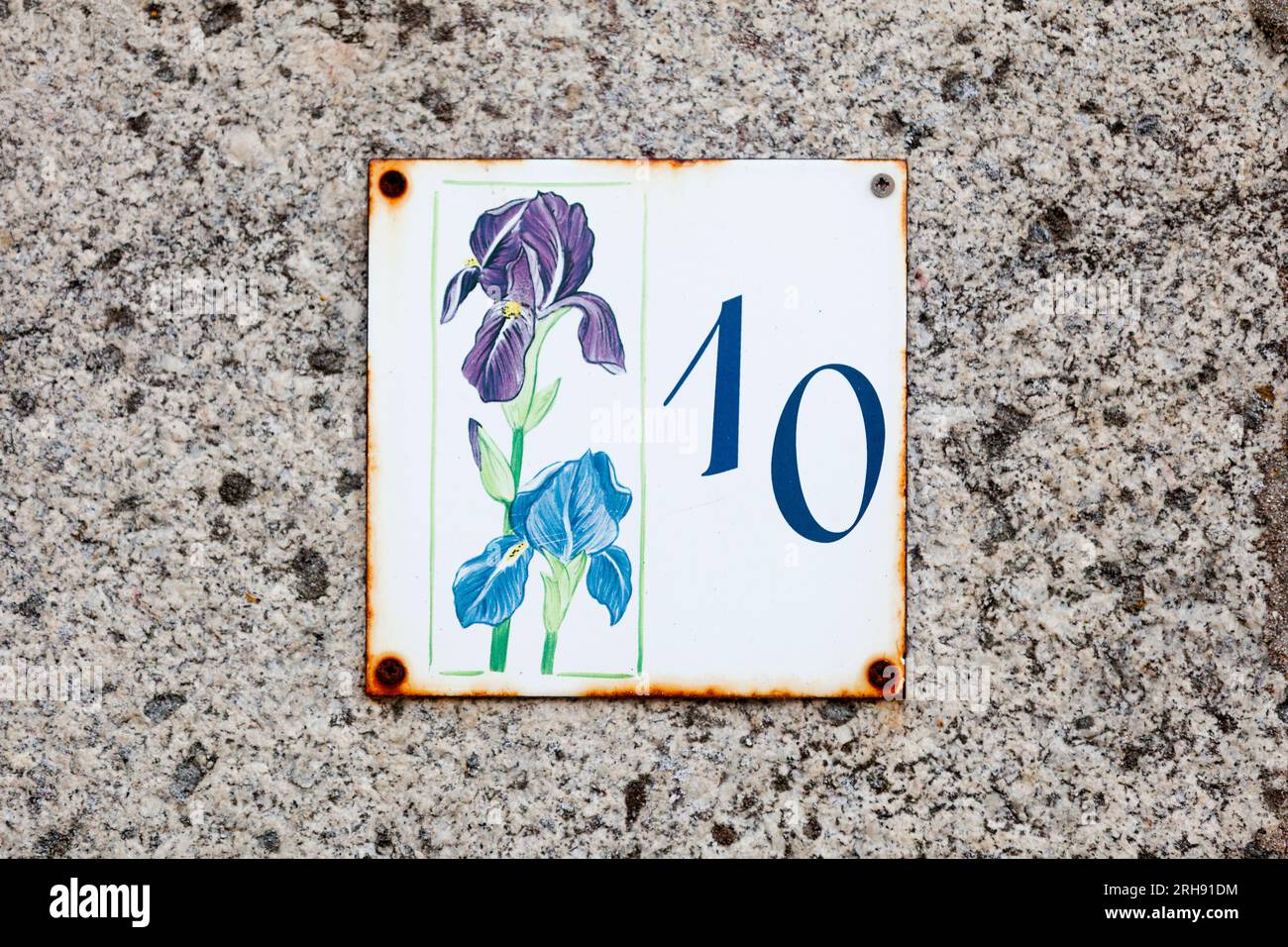 Close-up on an enameled plaque with the Number 10 on a stone wall Stock ...