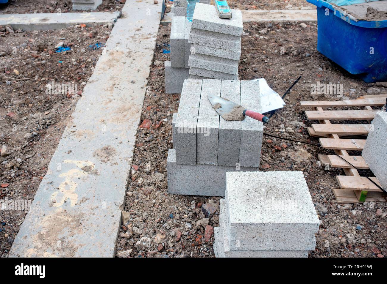 Concrete blocks delivered to construction site and placed next to the ...