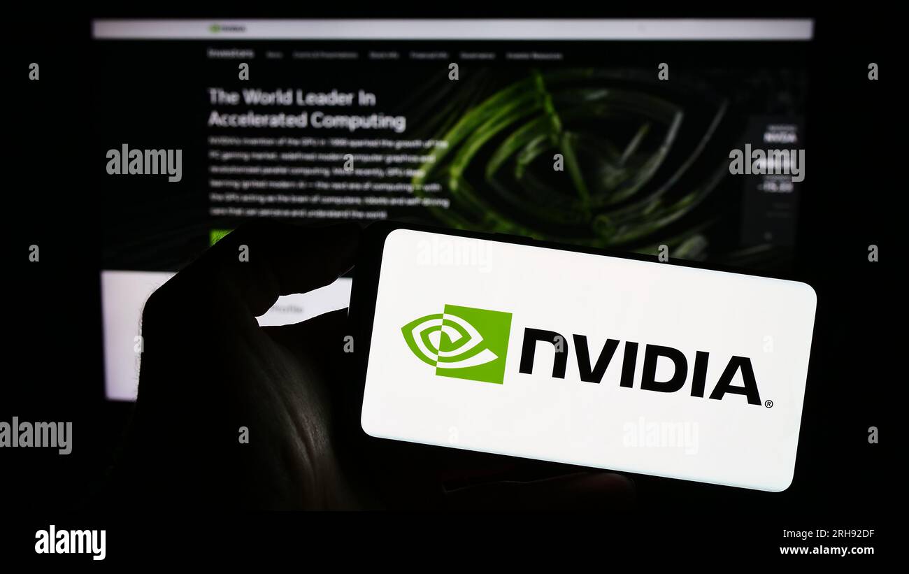 Person holding mobile phone with logo of American technology company ...