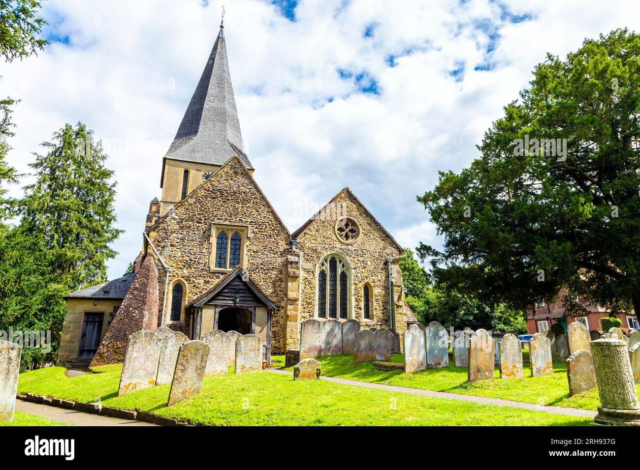 St James's Church and churchyard with headstones in Shere village ...