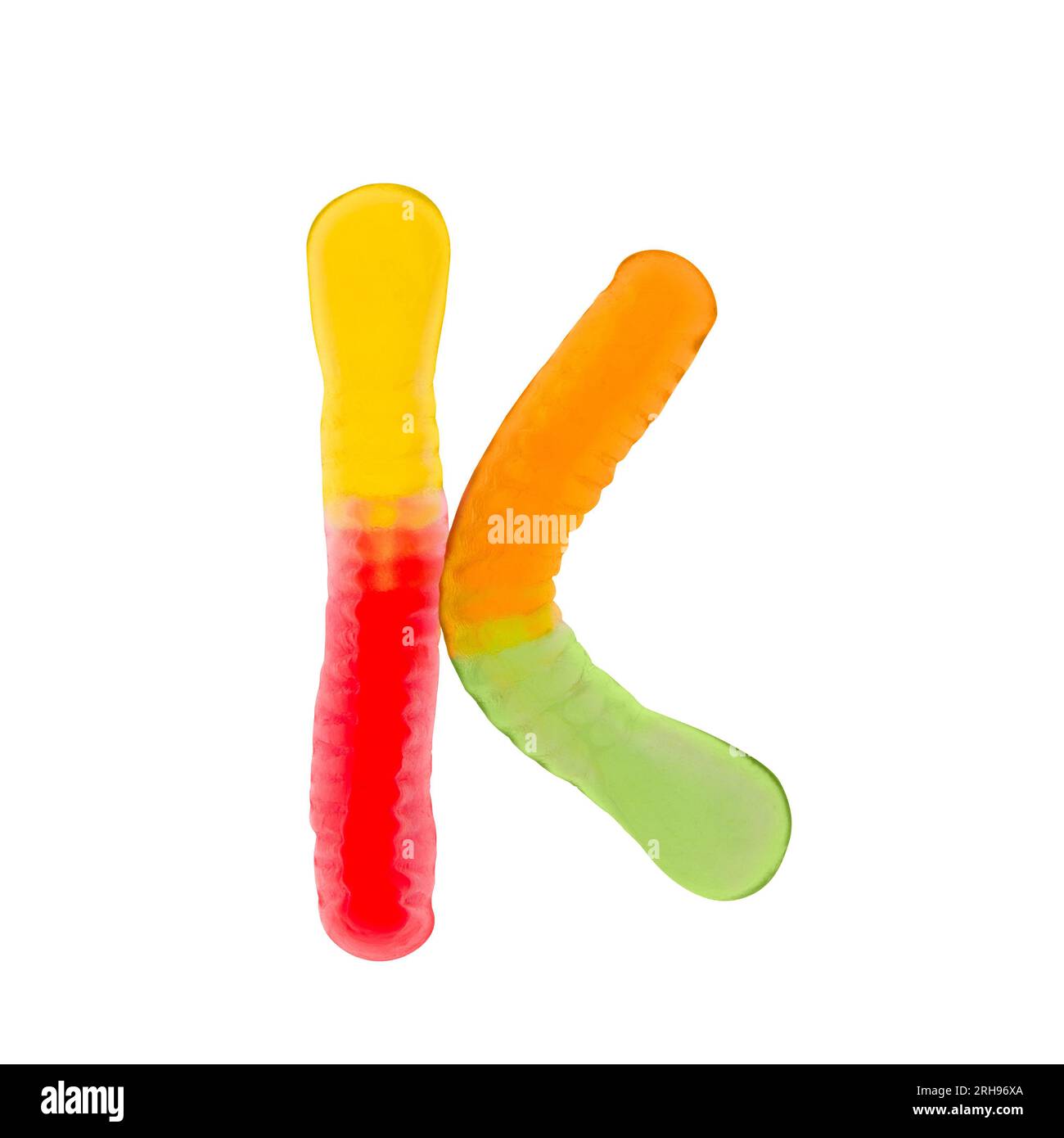 Letter K made of multicolored gummi worms and isolated on pure white ...