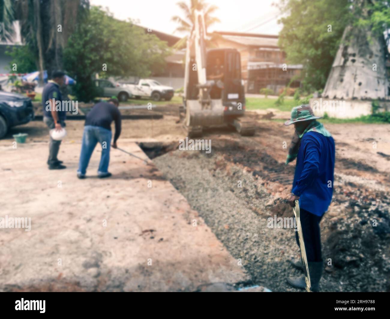Construction and engineer worker steering a backhoe to renovate the ...