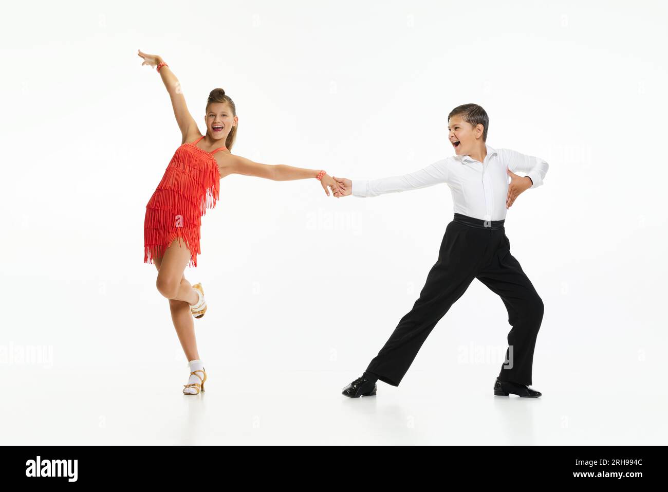 Boy and girl, children, friends making beautiful performance, dancing ...