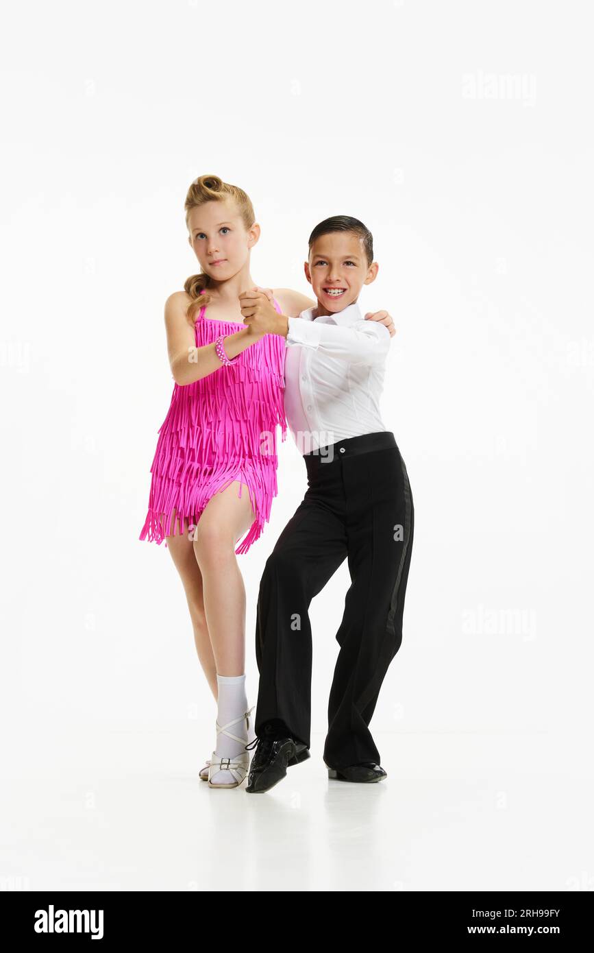 Beautiful, stylish children boy and girl dancing retro style dance ...