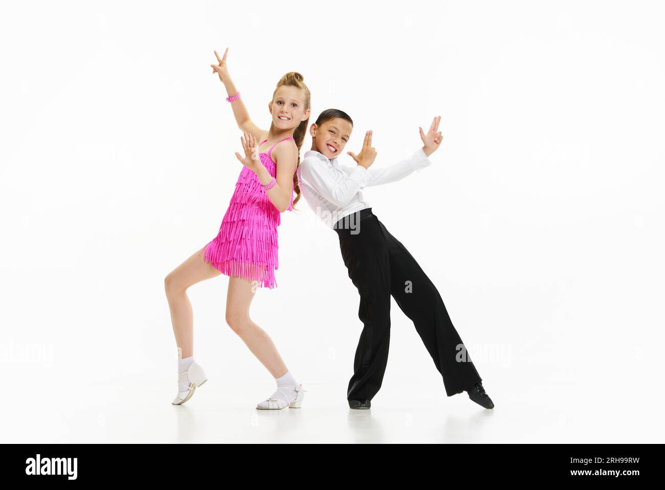 Beautiful, stylish children boy and girl dancing retro style dance ...