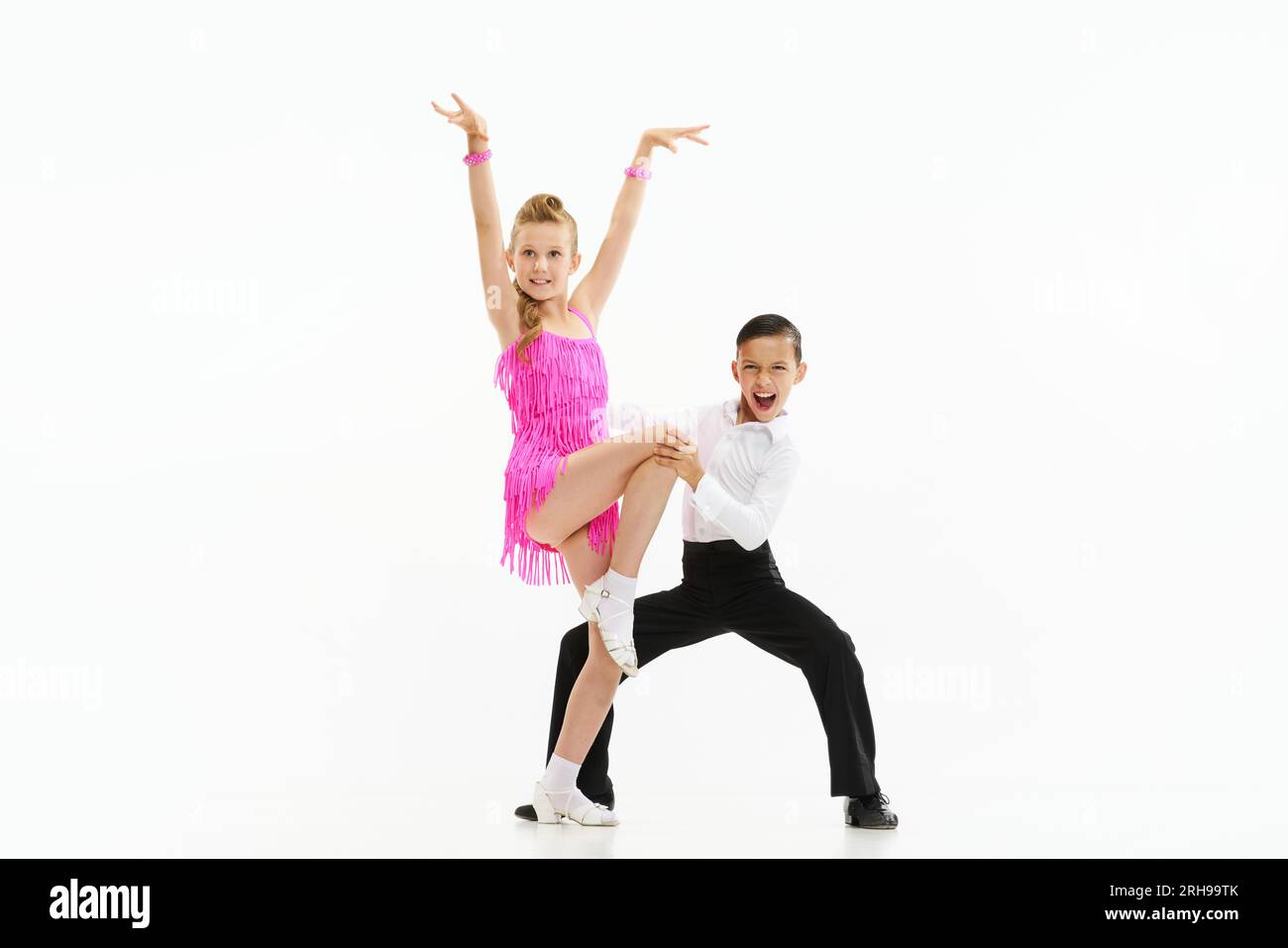 Beautiful, stylish children boy and girl dancing retro style dance ...