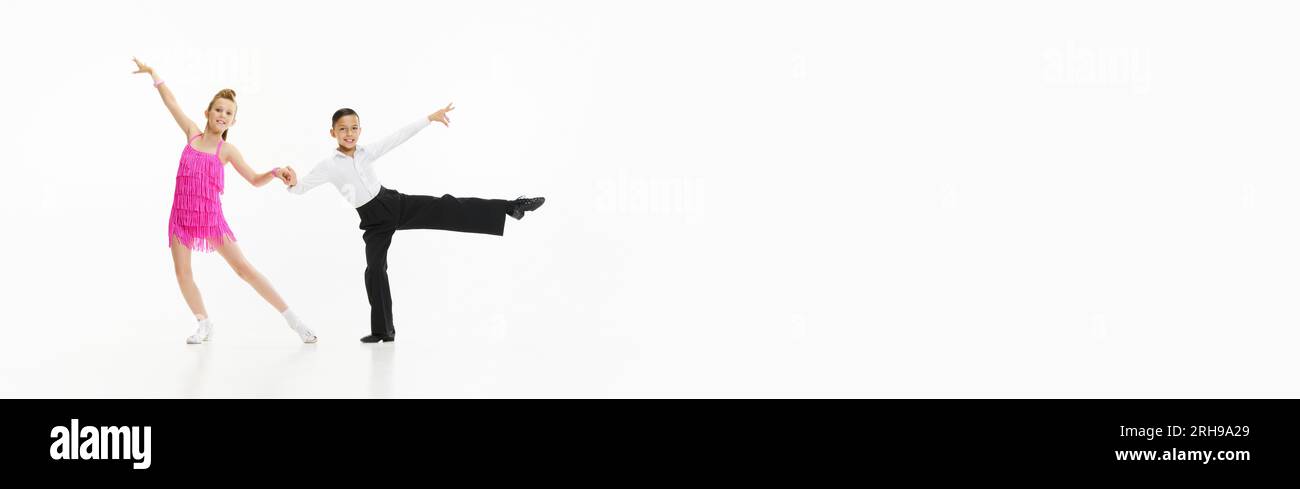 Dance school. Children, boy and girl in stage costume dancing retro ...