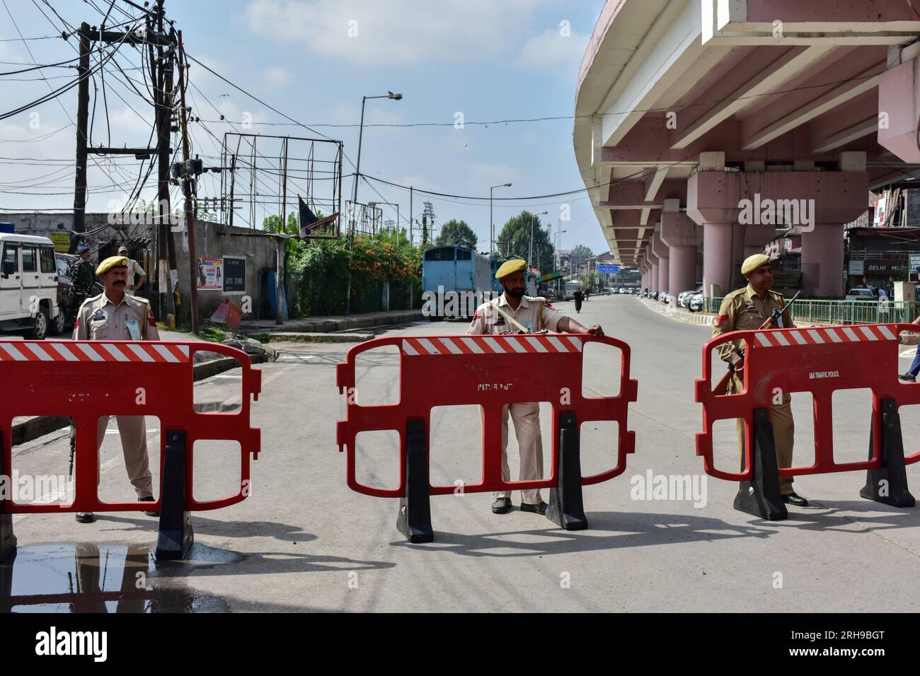 Government forces stand alert near the temporary check-post during the ...
