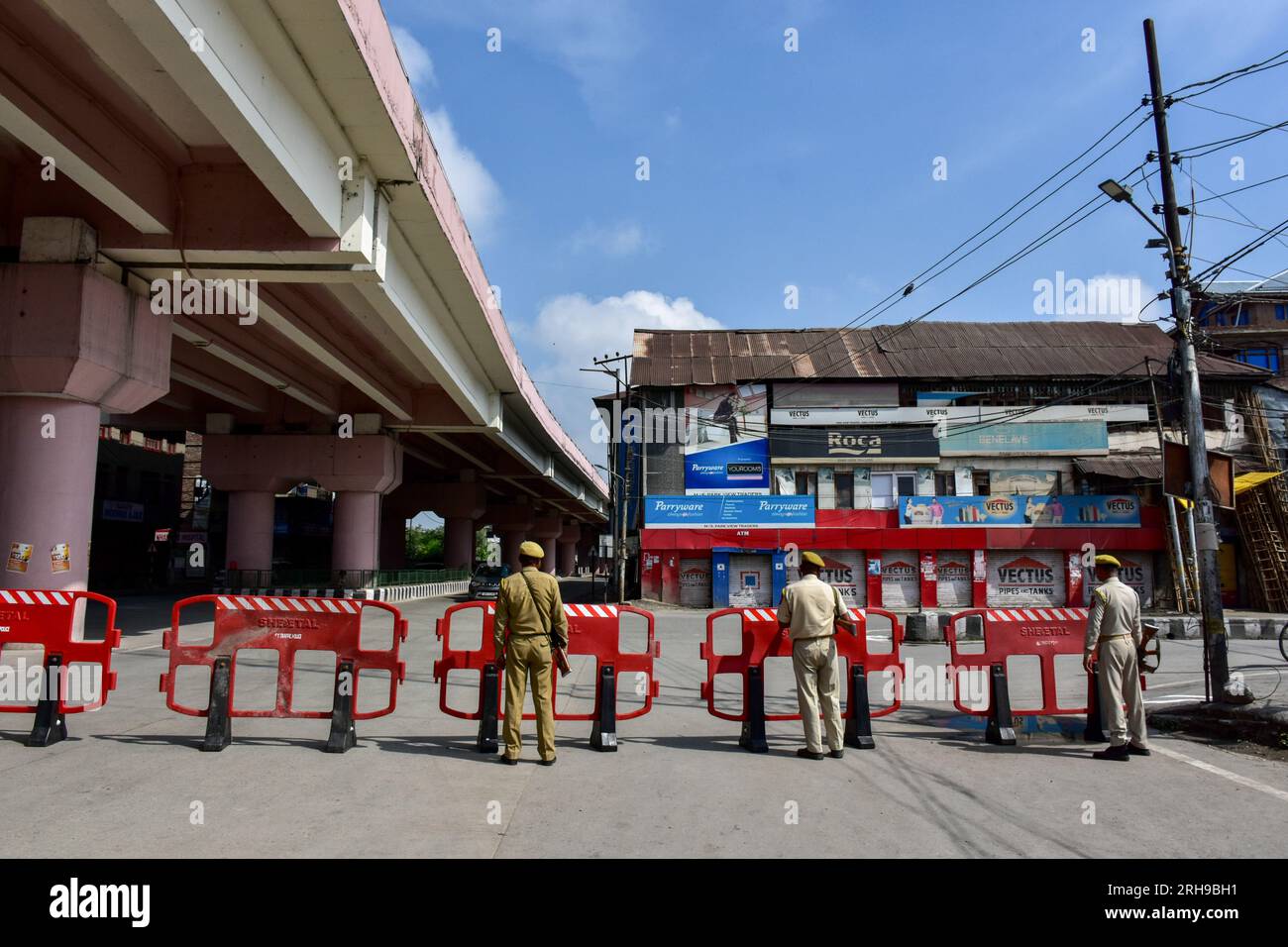 Government forces stand alert near the temporary check-post during the ...