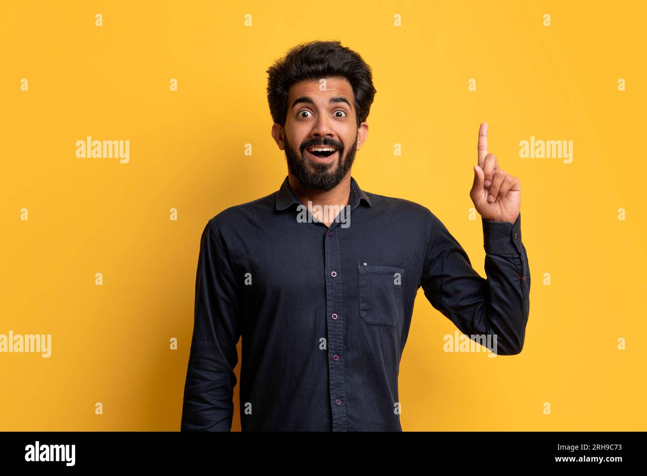 Idea Concept. Excited Young Indian Man Pointing Finger Up Stock Photo ...