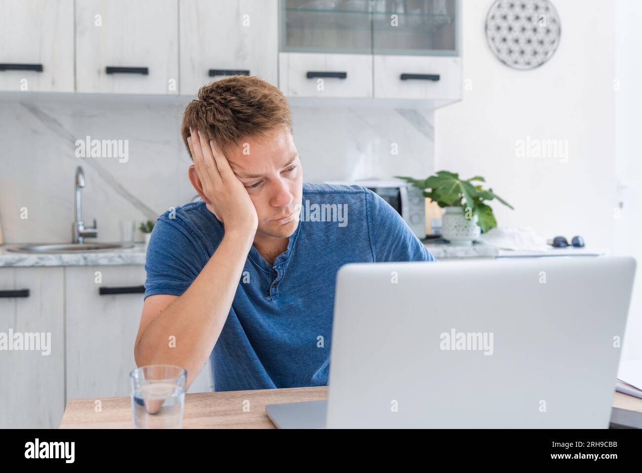 Tired man laptop working home hi-res stock photography and images - Alamy