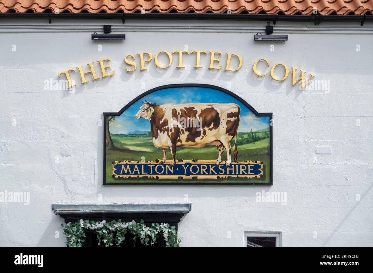 Close up of The Spotted Cow inn pub public house sign summer Malton ...