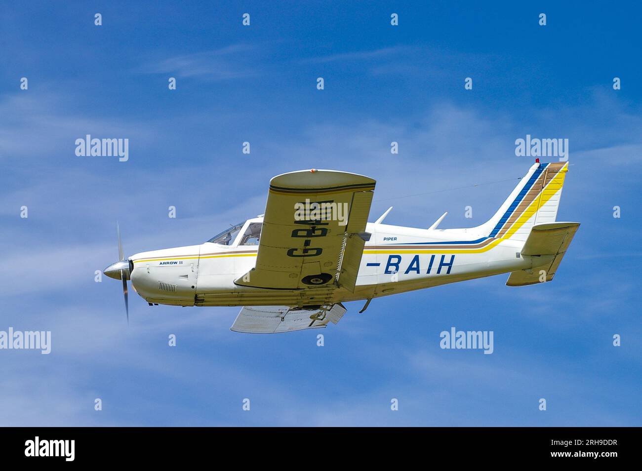 Piper PA-28 Cherokee Arrow II G-BAIH light aircraft plane flying in ...