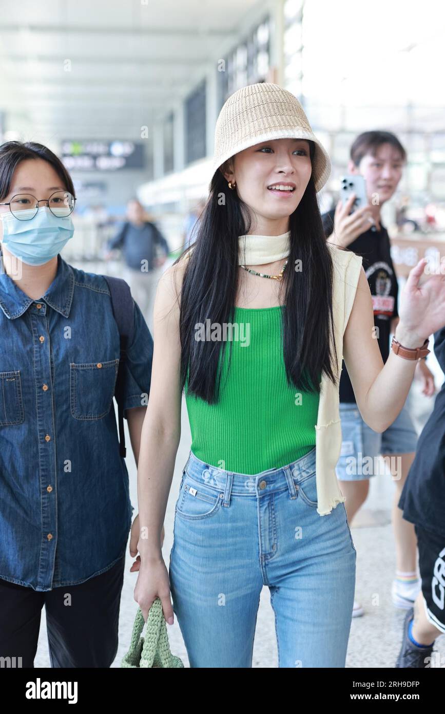 Hong Kong actress and fashion model Janice Man appears at the airport ...