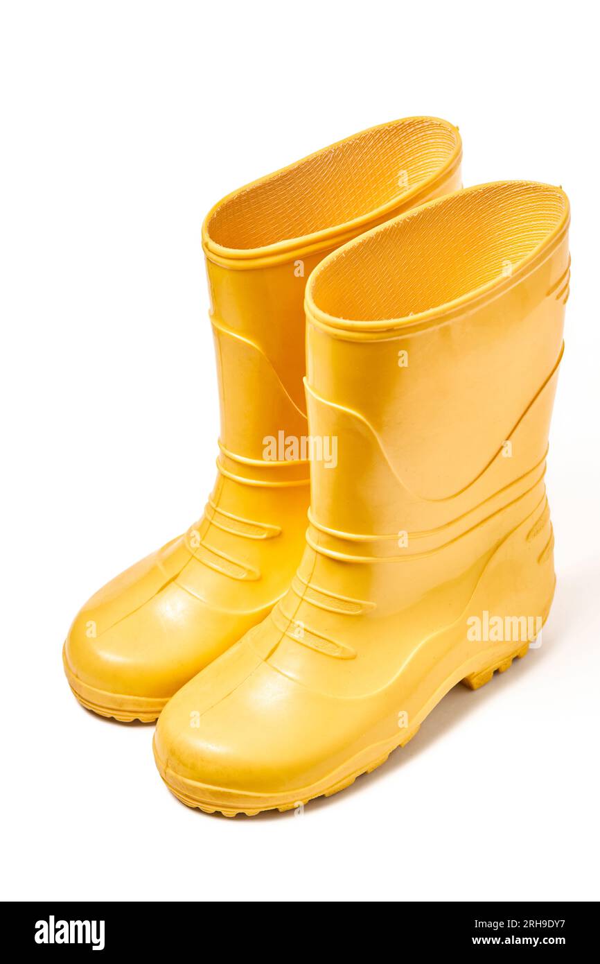 Pair of yellow rubber boots for kids isolated on white background Stock ...