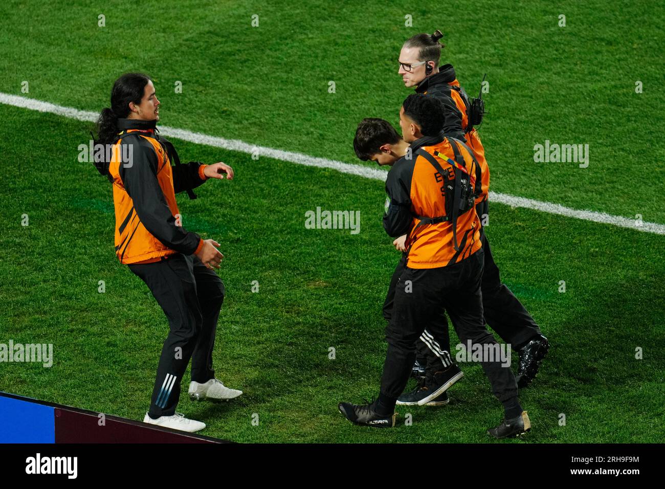 A pitch invader is being taken away during the Women's World Cup ...