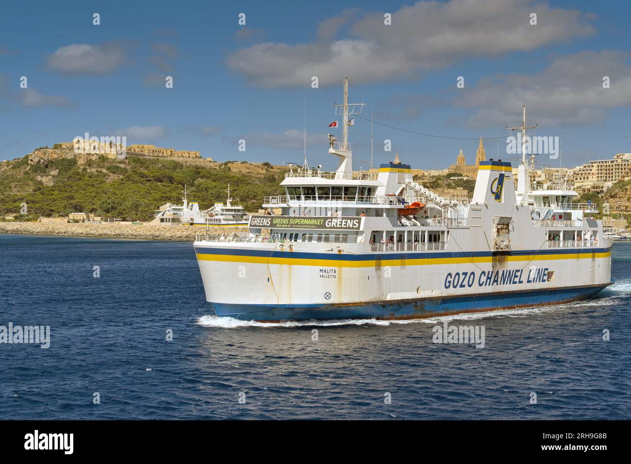 Gozo, Malta - 5 August 2023: Ferry leaving Mgarr harbour taking ...