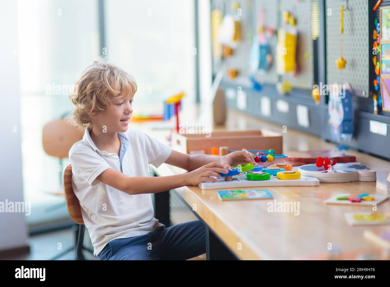 Child with educational toys in school. Science class or robotics club ...