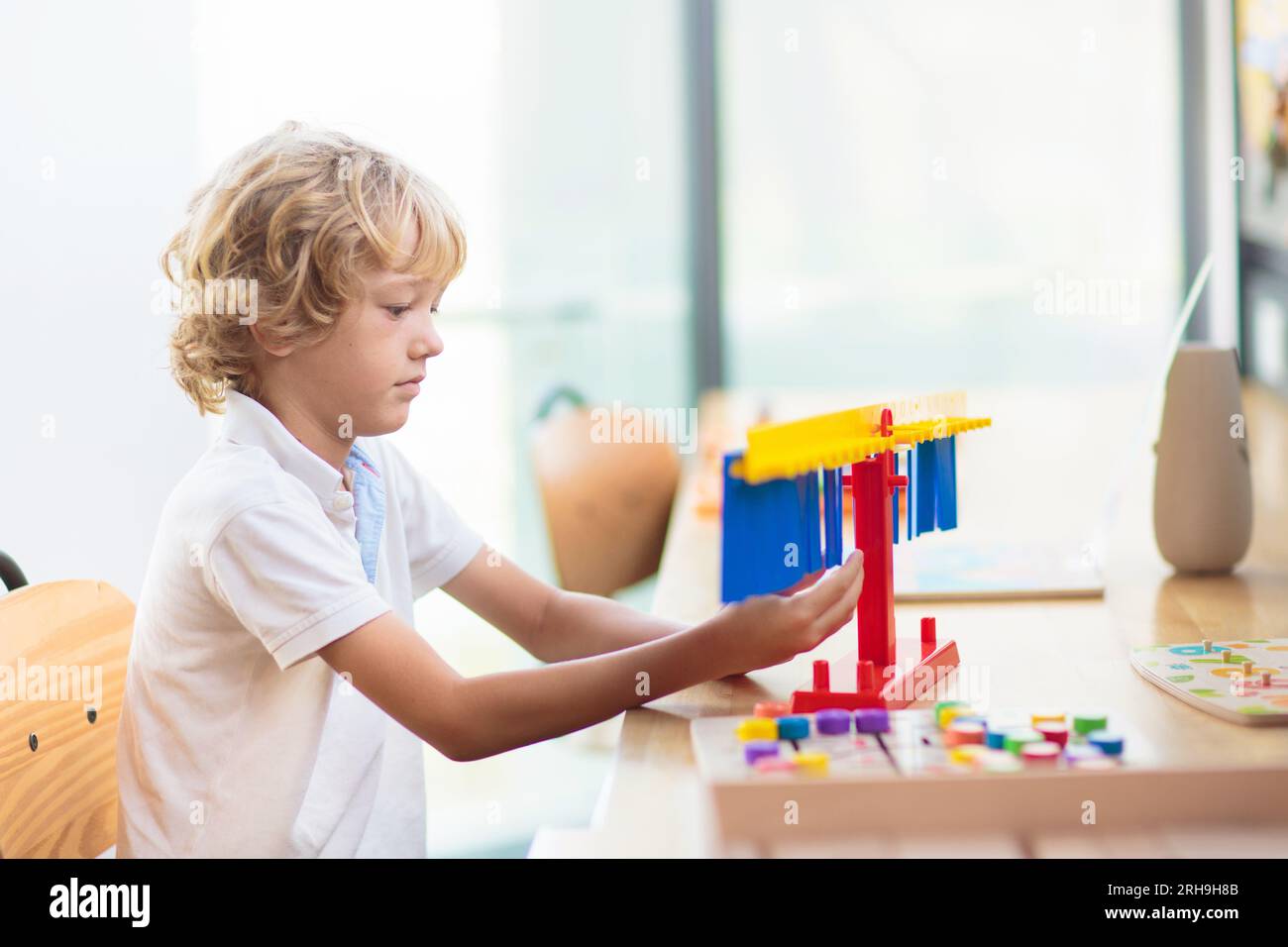 Child with educational toys in school. Science class or robotics club ...