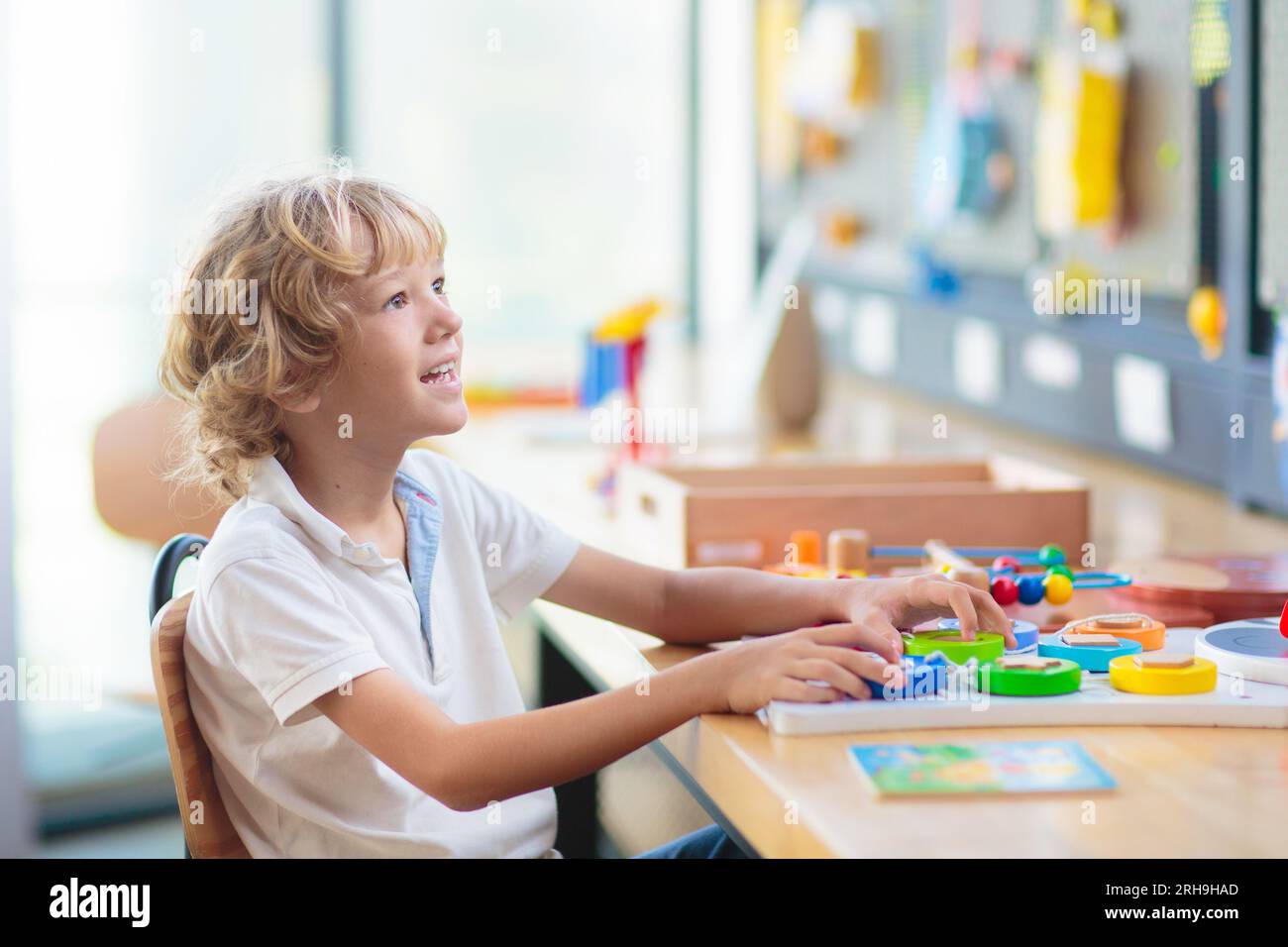 Child with educational toys in school. Science class or robotics club ...