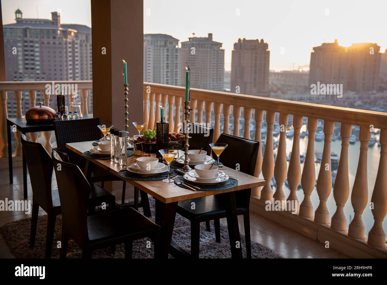Dinner table at rooftop with sunset view at pearl Qatar. view of Peral ...