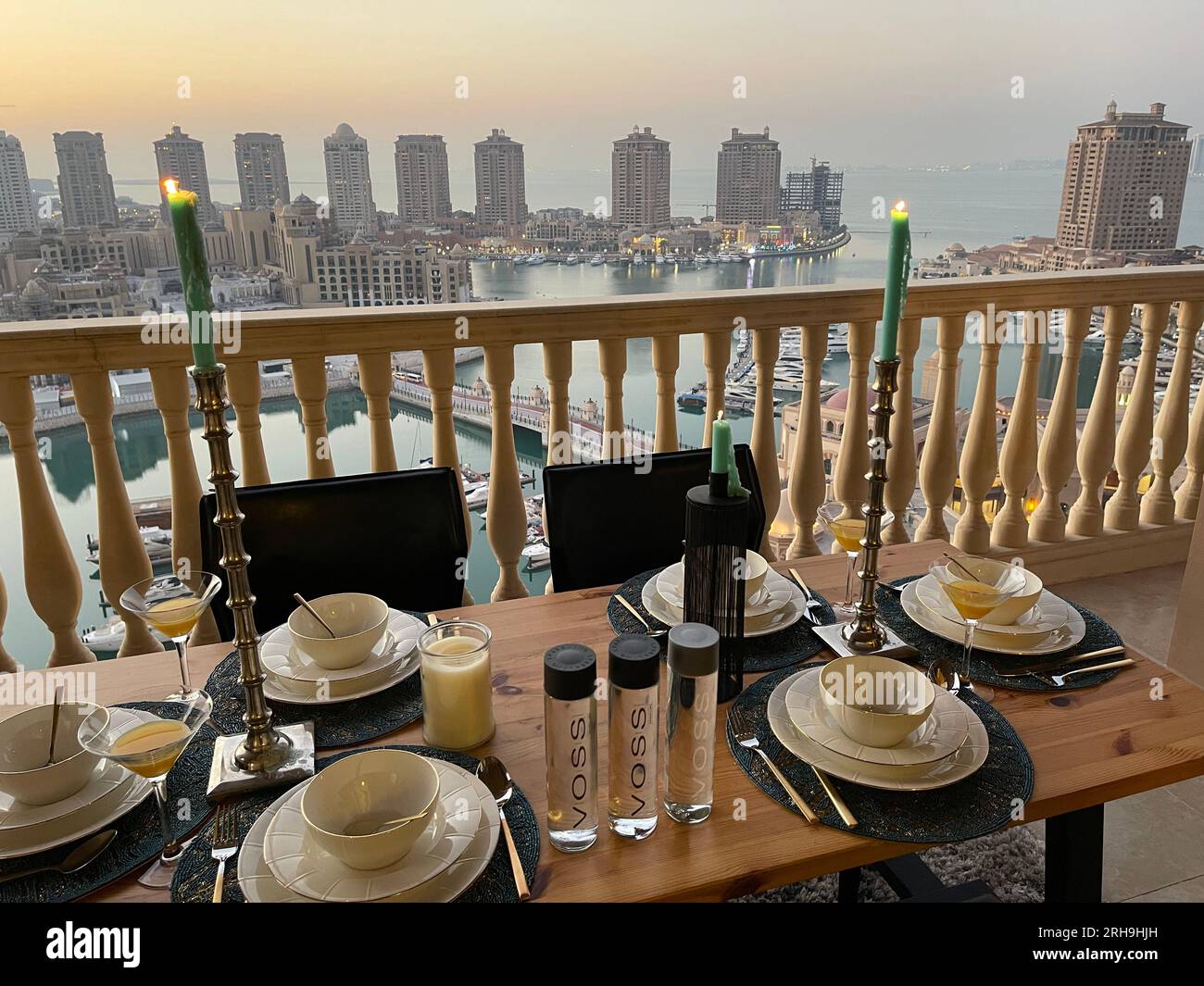 Dinner table at rooftop with sunset view at pearl Qatar. view of Peral ...