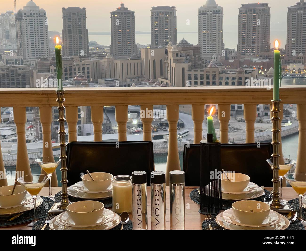 Dinner table at rooftop with sunset view at pearl Qatar. view of Peral ...