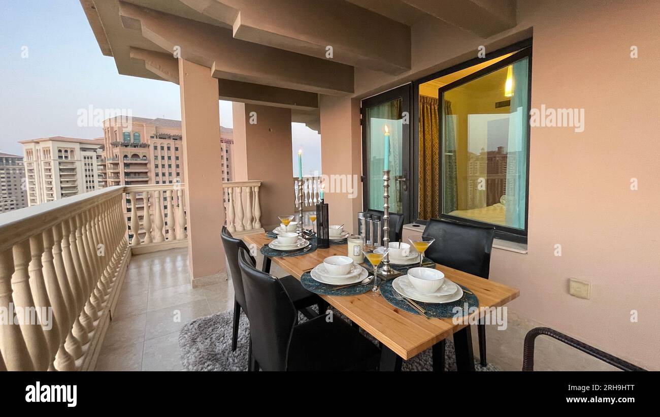 Dinner table at rooftop with sunset view at pearl Qatar. view of Peral ...