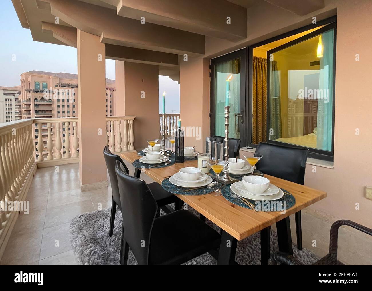 Dinner table at rooftop with sunset view at pearl Qatar. view of Peral ...