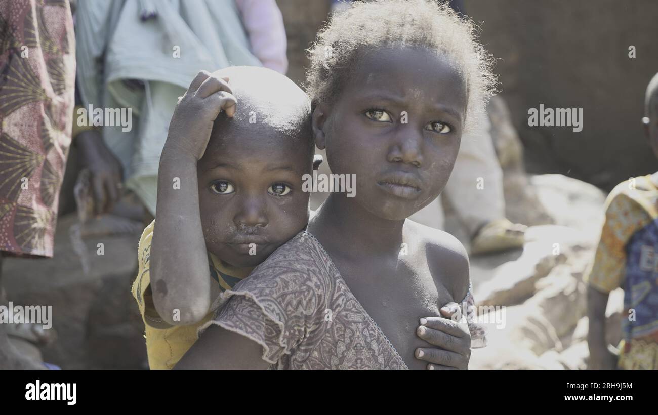 Beautiful Picture Of An African Sister Holding Her Younger Brother On
