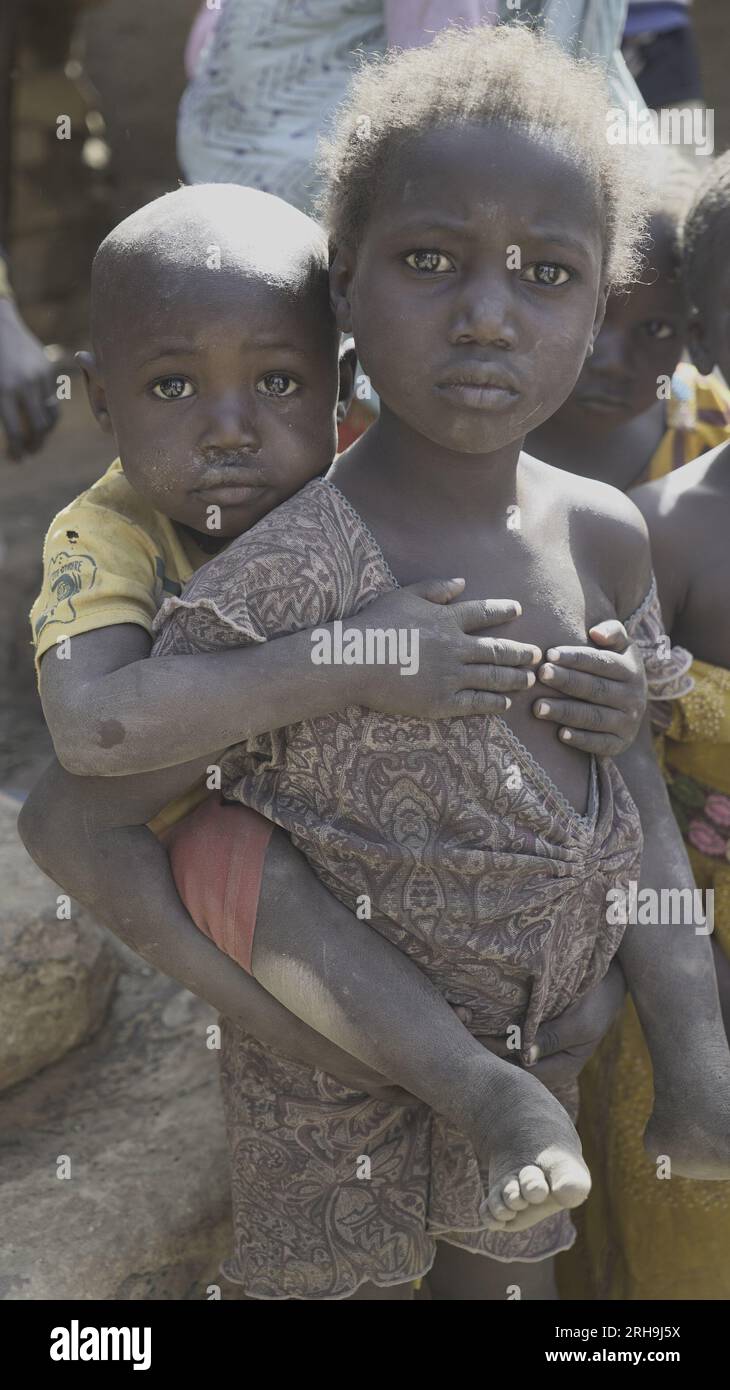 beautiful picture of an African sister holding her younger brother on ...