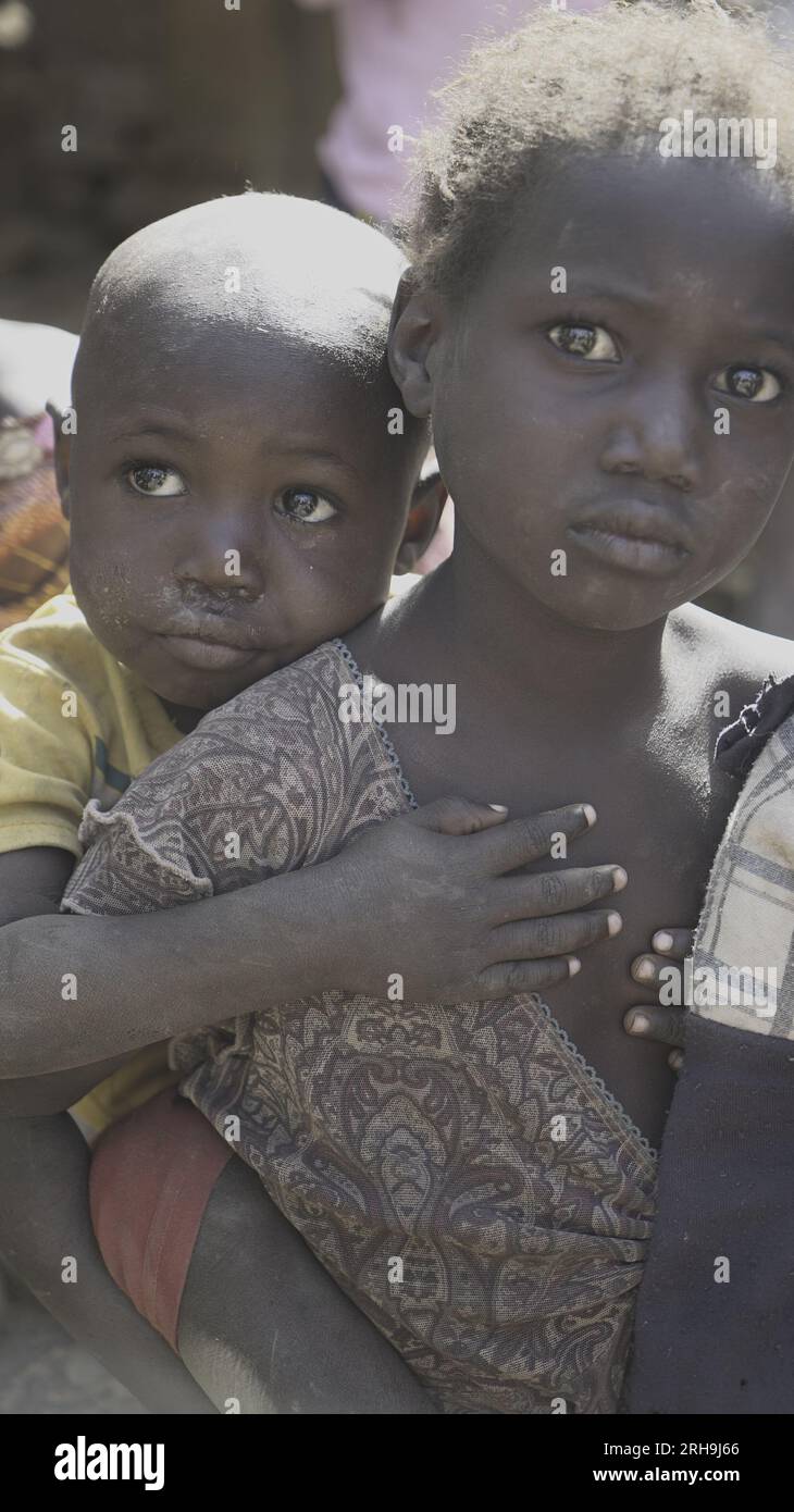 beautiful picture of an African sister holding her younger brother on ...