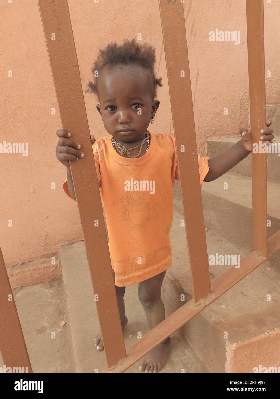 Mali- Elder African village leader with one blind white eye holding a ...