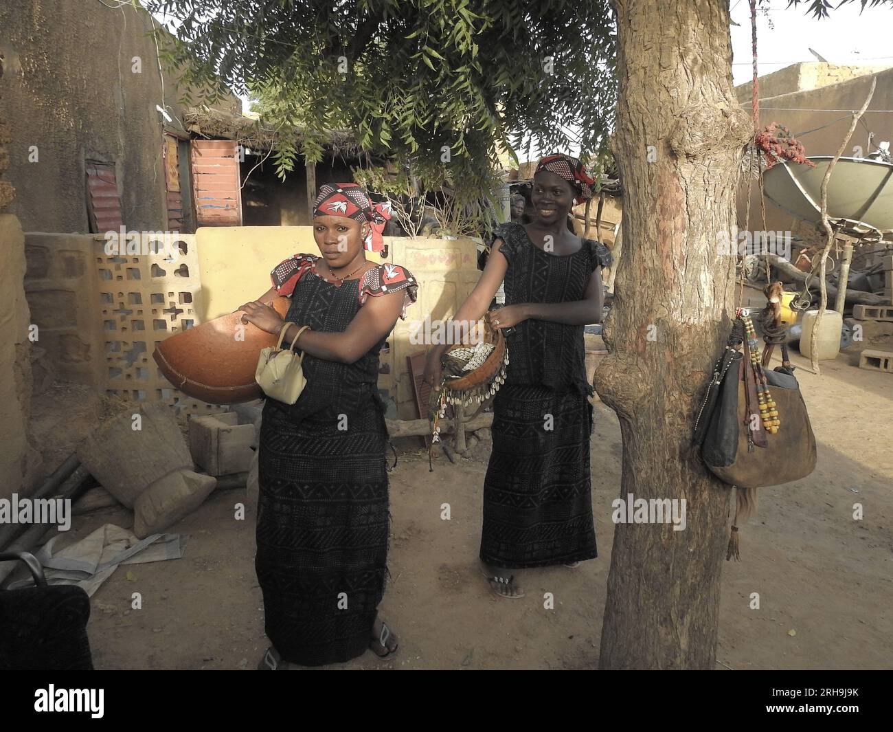 African mom carrying her child on her back. showing the beautiful ...
