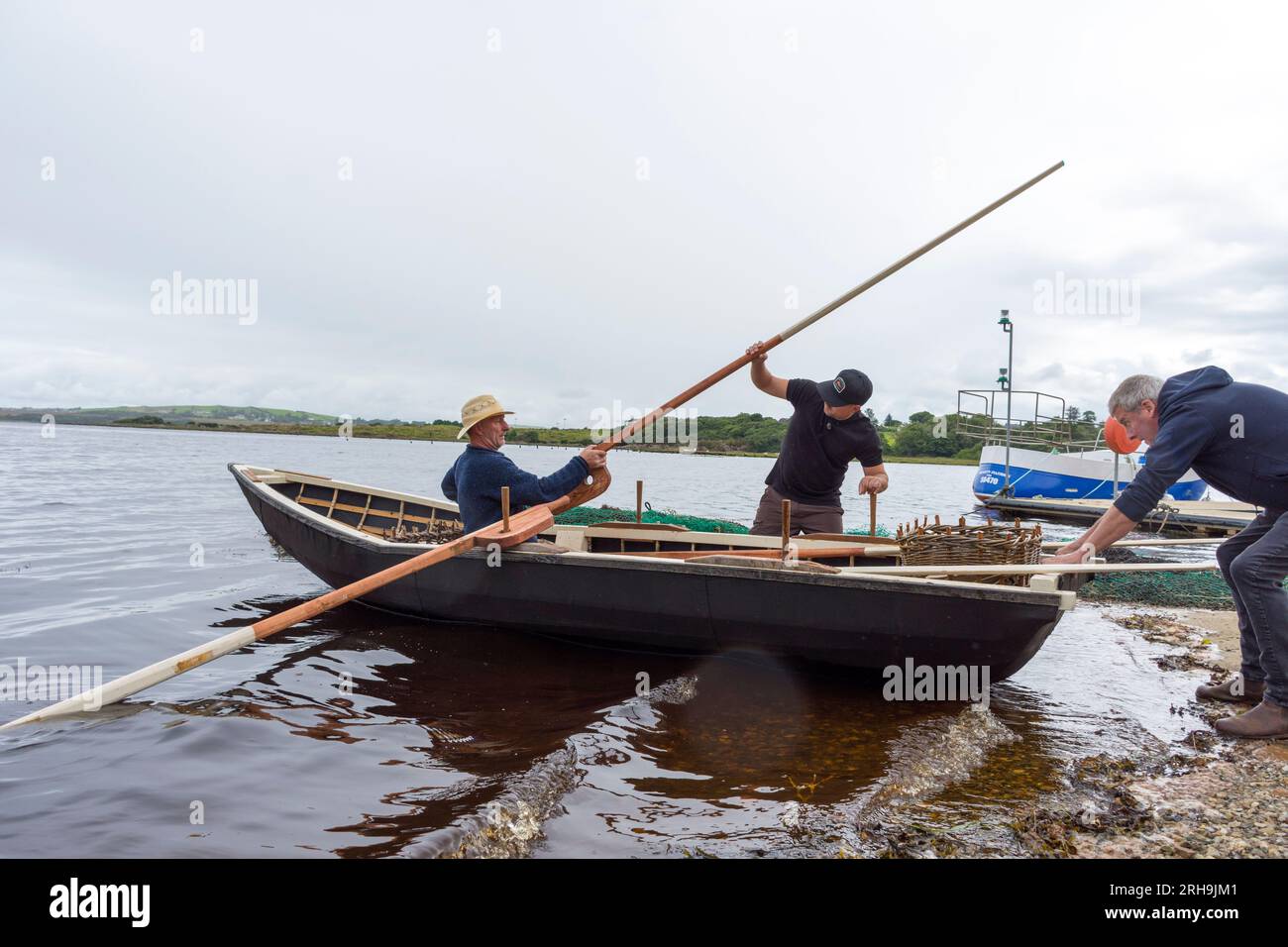 Launching the traditional hand built currach boat, Ardara, County ...